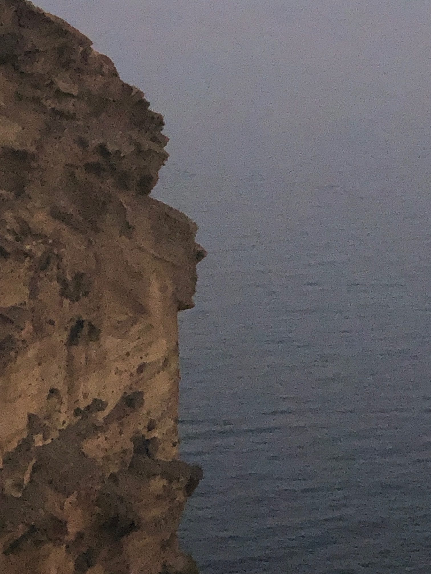 See the Face in The Rock While Watching the Santorini Sunset